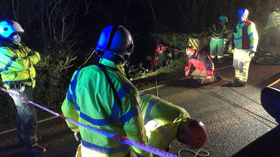 Driver rescued after car slides down Derbyshire embankment - BBC News