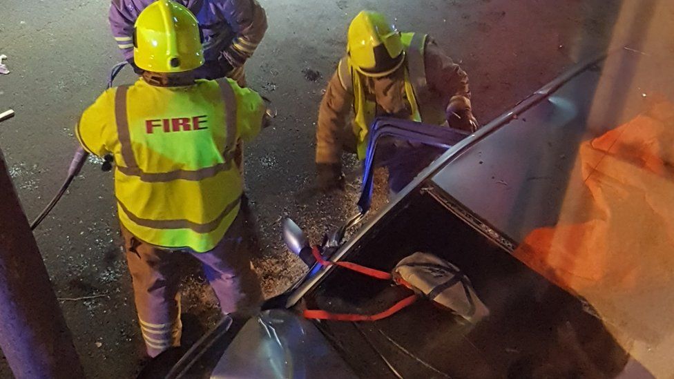 Car crashes into lamp-post outside couple's Treharris home - BBC News