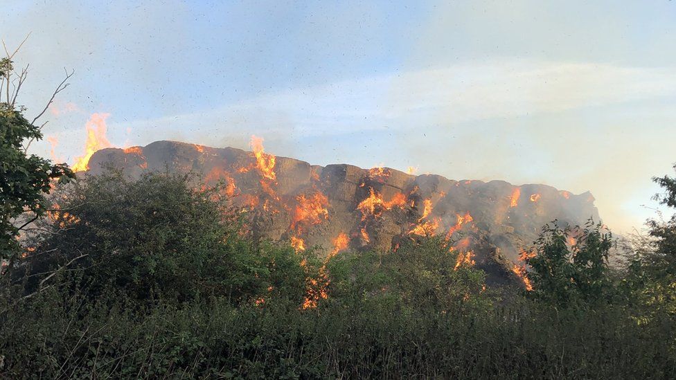 Haystack fire breaks out close to M25 in Hertfordshire - BBC News