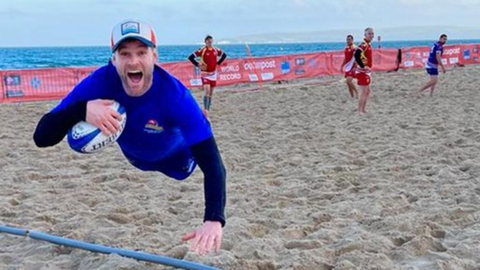 Poole touch rugby team's 34-hour beach match confirmed as record - BBC News