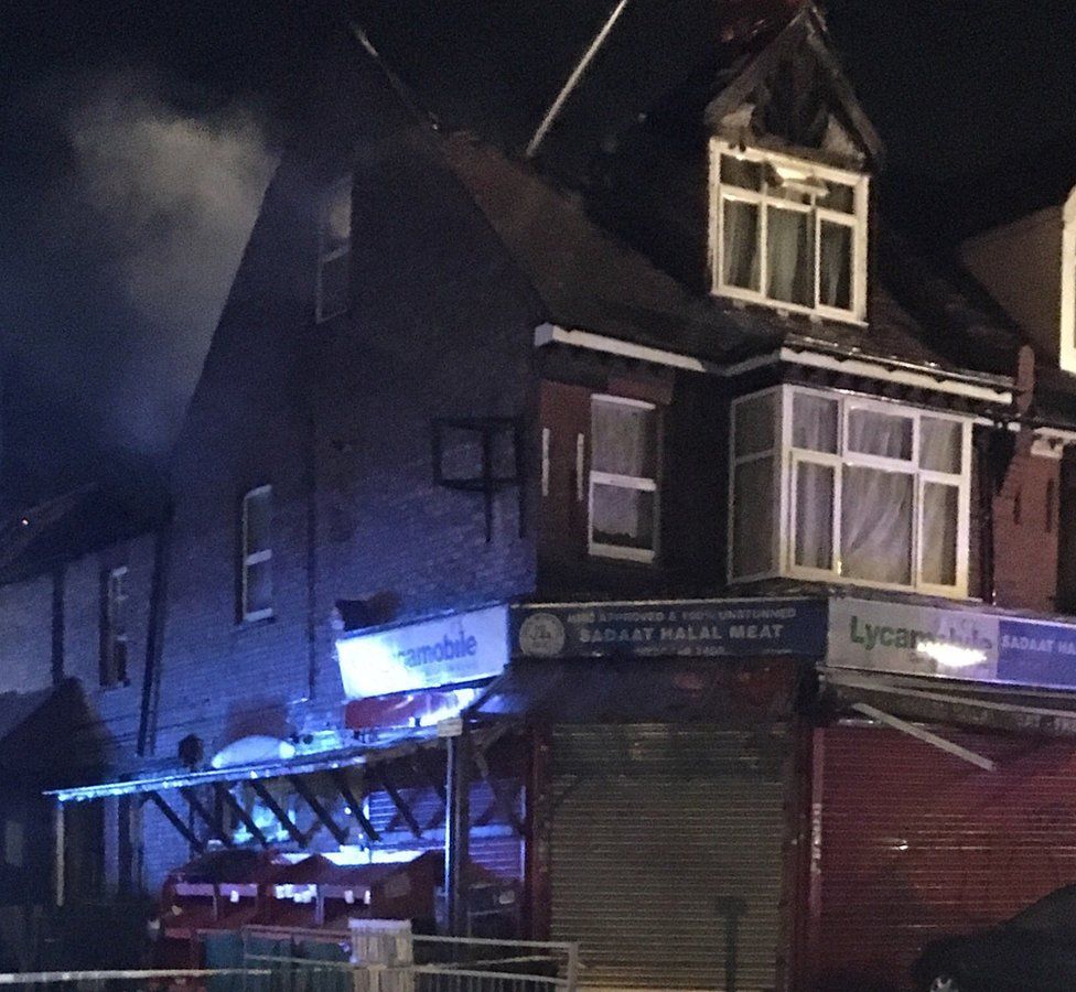 Passerby leads three to safety from Harrow fire - BBC News