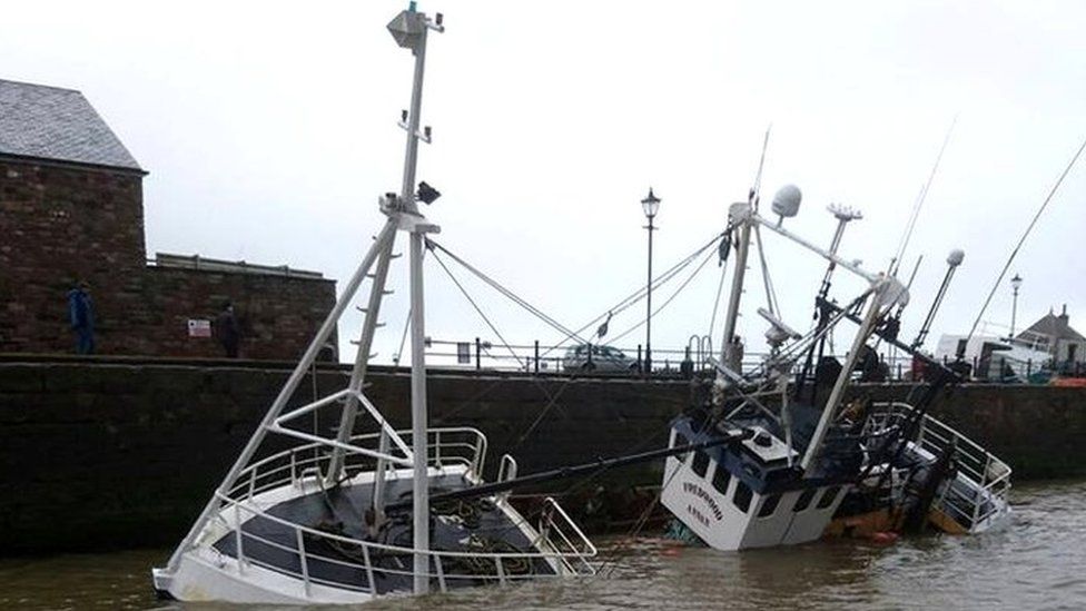 Crew of four rescued from sinking Maryport trawler - BBC News