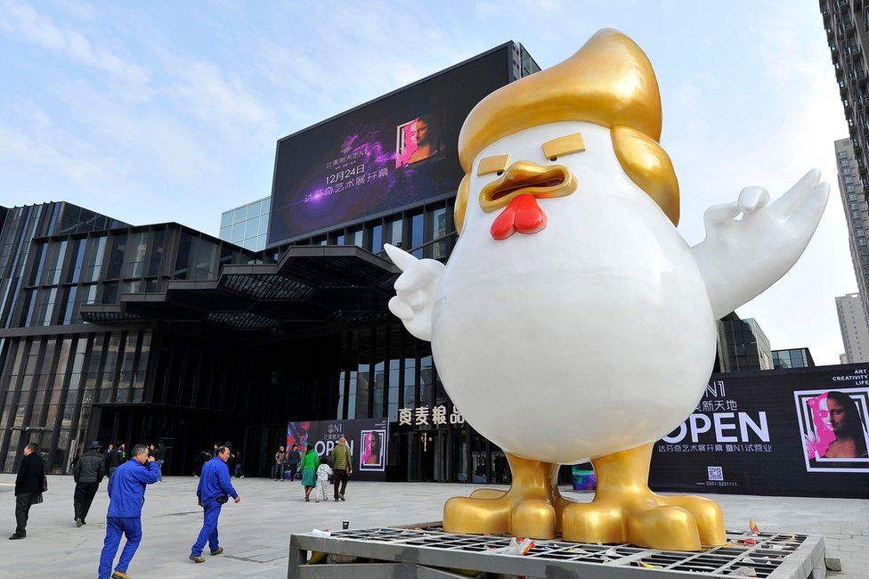 Chinese Year of the Rooster marked with huge Trump sculpture - BBC News