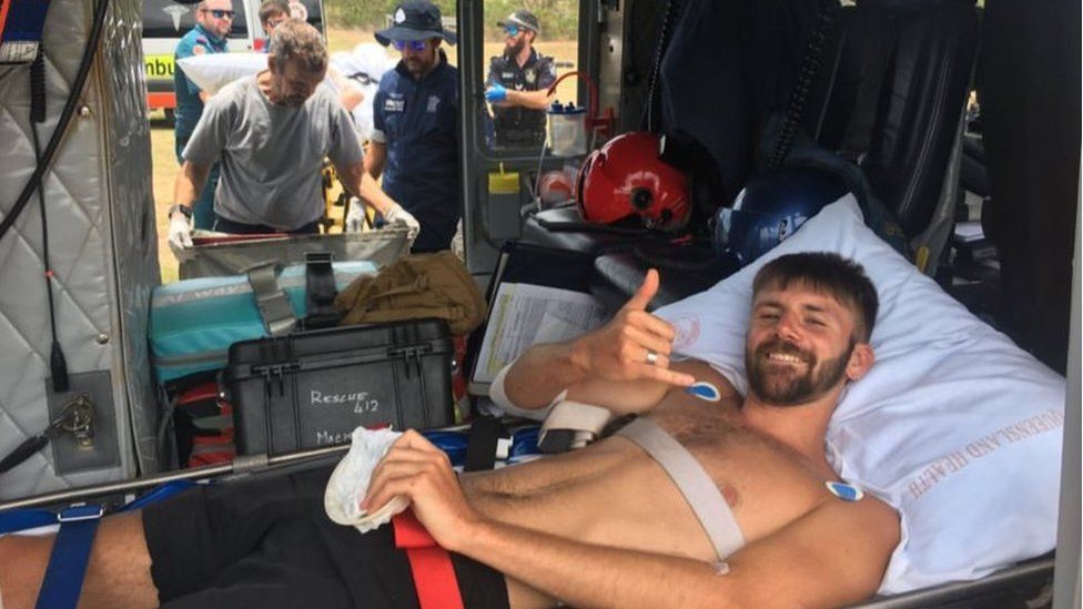 Queensland shark attack: Two British men injured at tourist spot - BBC News