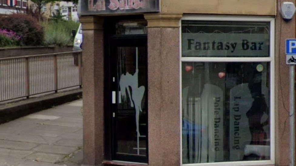 Lap dancing club told to cover up advertising - BBC News
