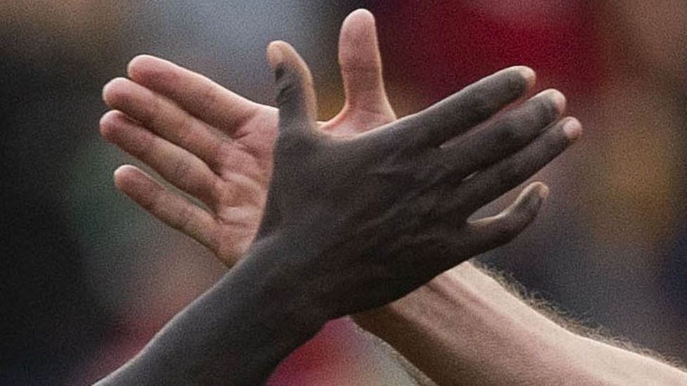 Racially-abused footballer dismayed at FA misconduct charge - BBC News