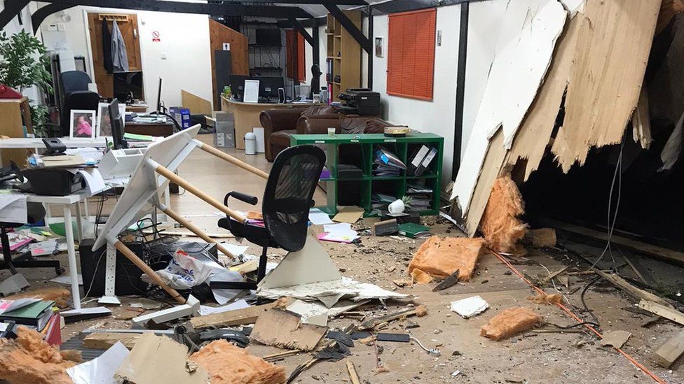 Car crashes into Bedfordshire office 'causing £20k damage' - BBC News