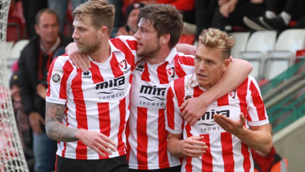 Football champions Cheltenham Town cheered in open-top bus tour - BBC News
