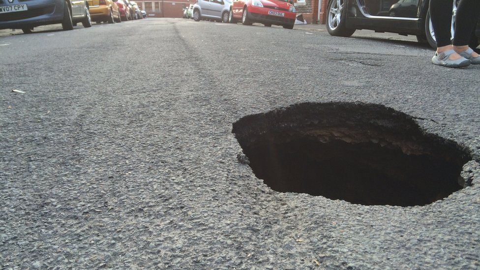3ft deep sink hole appears in road in Heath, Cardiff - BBC News