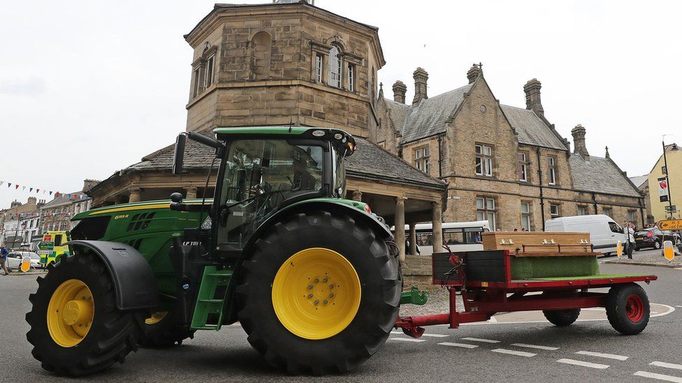 Thomas Brown funeral: Coffin pulled by tractor - BBC News