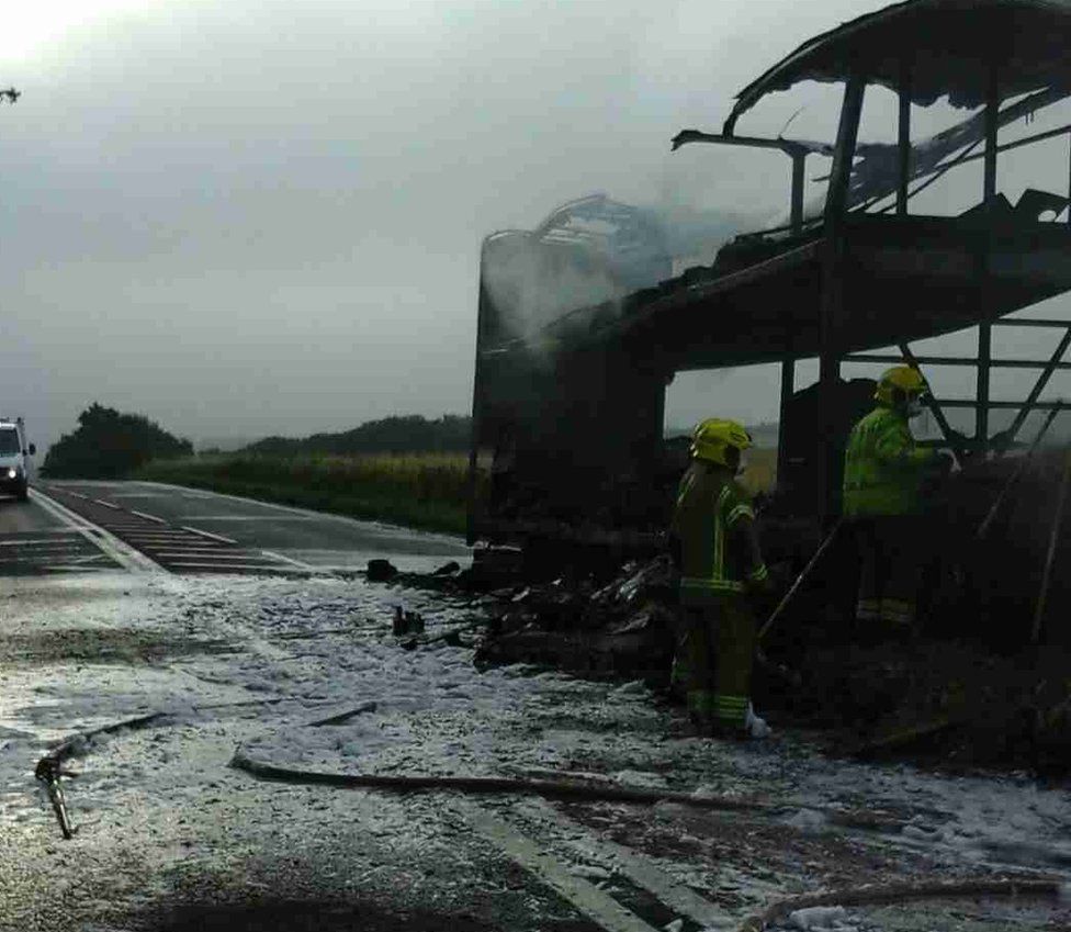 A303 lorry blaze leaves nails embedded in road surface - BBC News