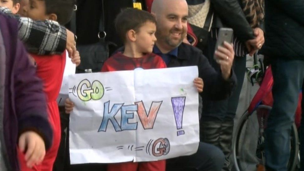 River Severn record swimmer, Kevin Brady, arrives in home city - BBC News