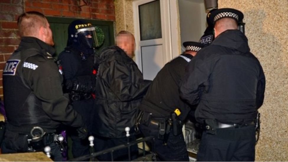 Kirkby raids: Seven held as police target drug and gun crime - BBC News