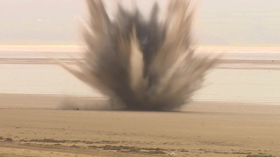 Army unit blows up 'bomb' on Cefn Sidan Beach - BBC News