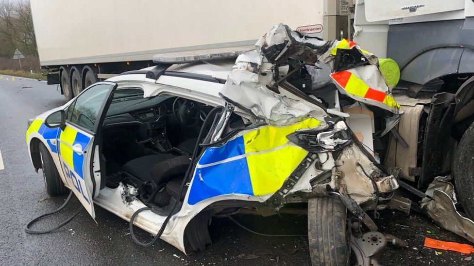 Lorry driver jailed for injuring two police officers in A1 crash - BBC News