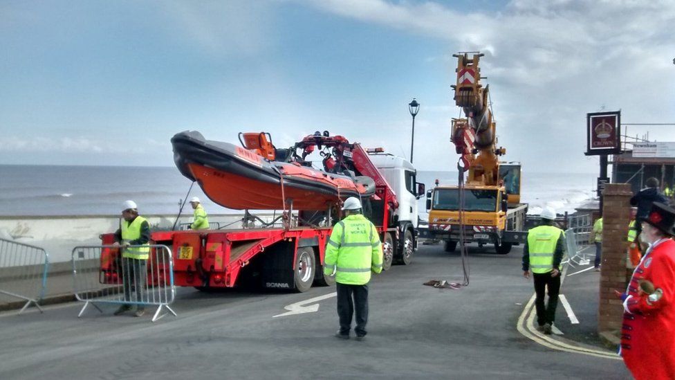 Crane lifts lifeboat into £1.4m centre at Sheringham - BBC News