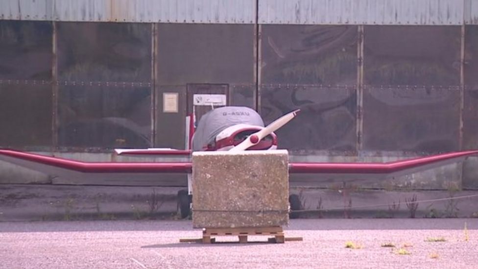 'Impounded' aircraft flies out of former Plymouth airport - BBC News