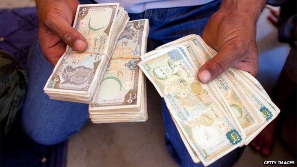Syria's economy cut in half by conflict - BBC News