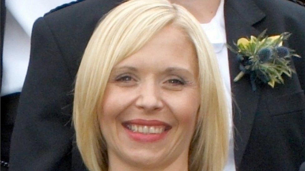 Woman 'killed by husband's car' named as Kim Clark - BBC News