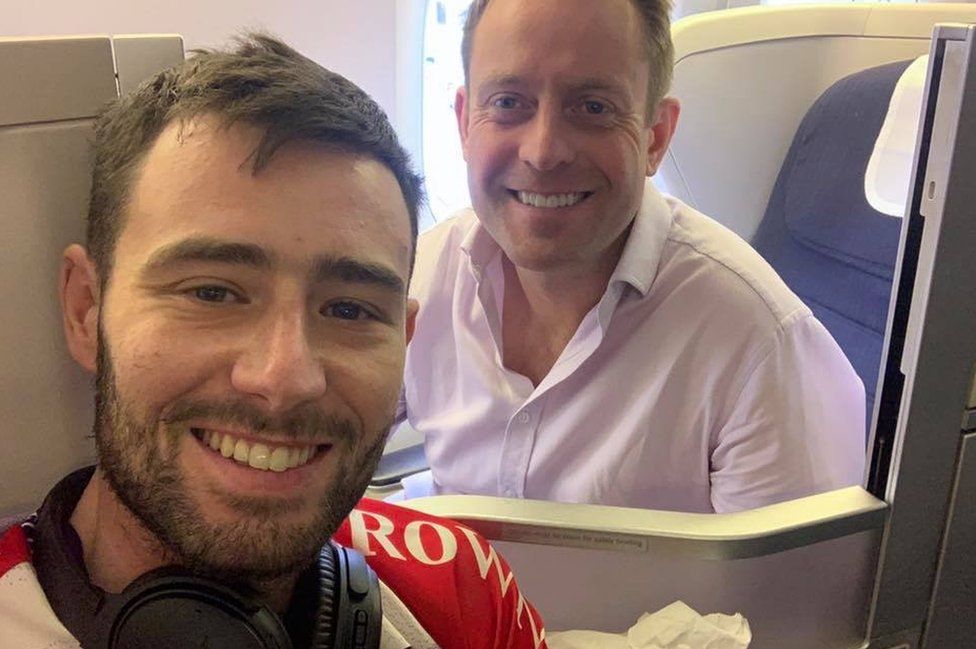 Injured cyclist Josh Quigley returns home to Scotland - BBC News