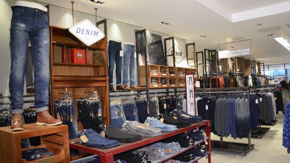 Next shares fall despite online sales offsetting store woes - BBC News