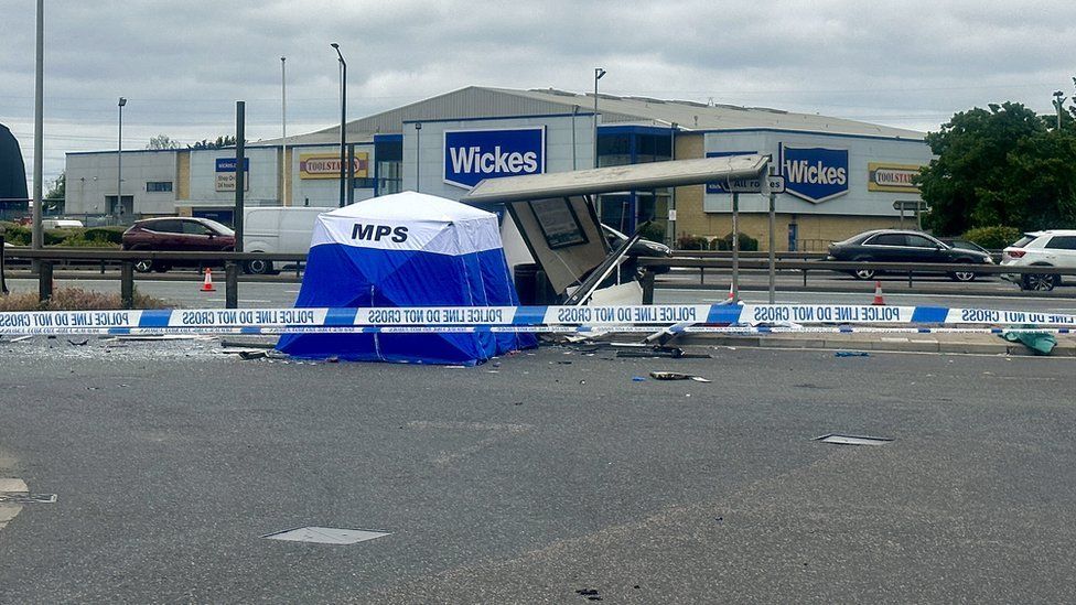 Man dies as car crashes into Edmonton bus stop - BBC News