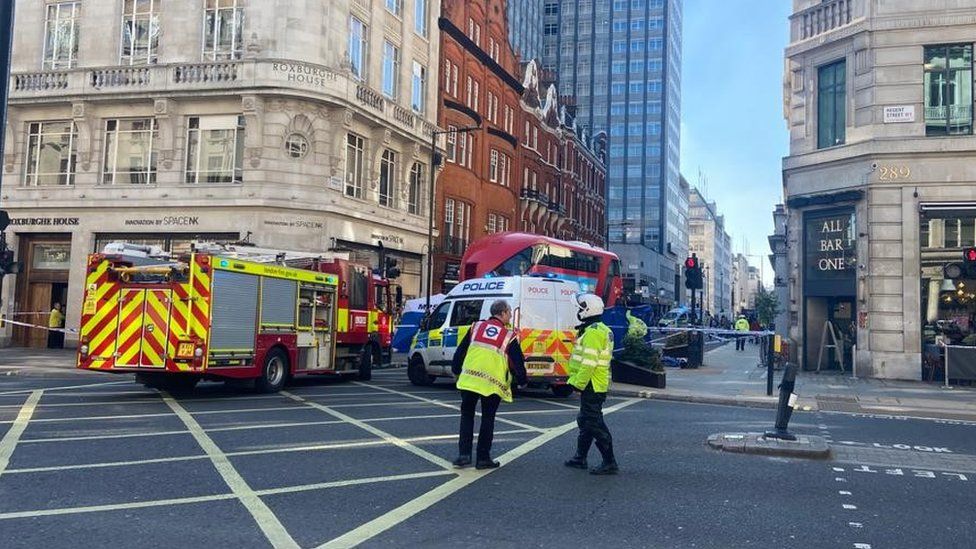 Woman dies following bus collision in central London - BBC News