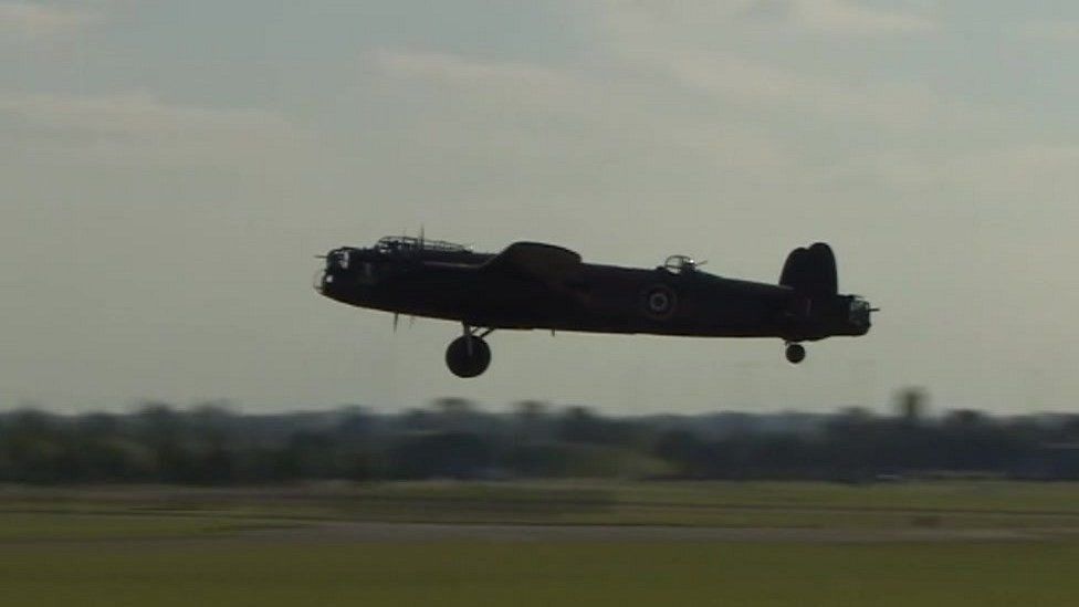 Fire-hit Lancaster bomber Thumper flies again after five months - BBC News