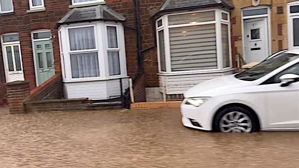Hunstanton clifftop waterfall photographed after storm - BBC News