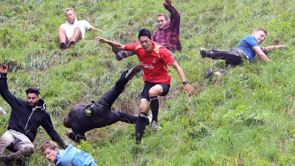 Cheese-rolling veteran equals all-time record - BBC News