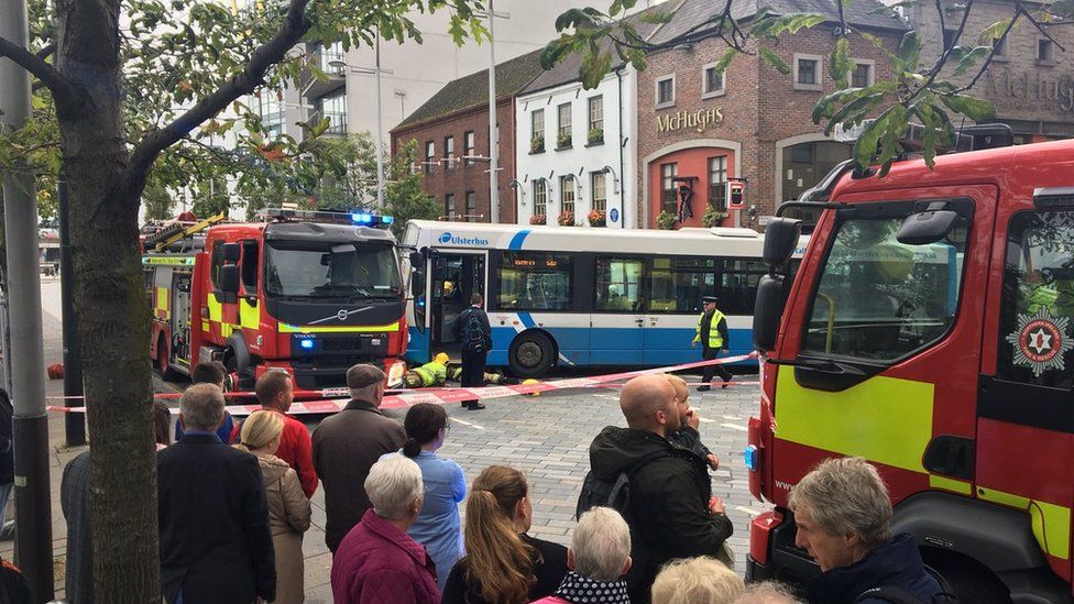Belfast emergency services free person trapped under bus - BBC News