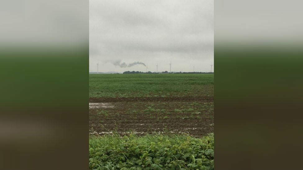 Doddington wind turbine fire follows storms - BBC News
