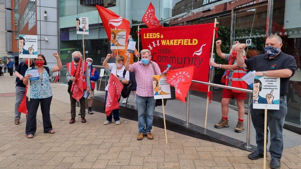 Unite union's jobs protest at Leeds debt charity office - BBC News