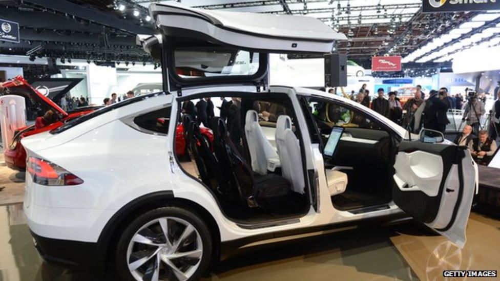 Tesla unveils Model X car with Falcon Wing doors - BBC News