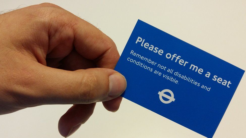 'Please offer me a seat' Tube badges rolled out on TfL - BBC News
