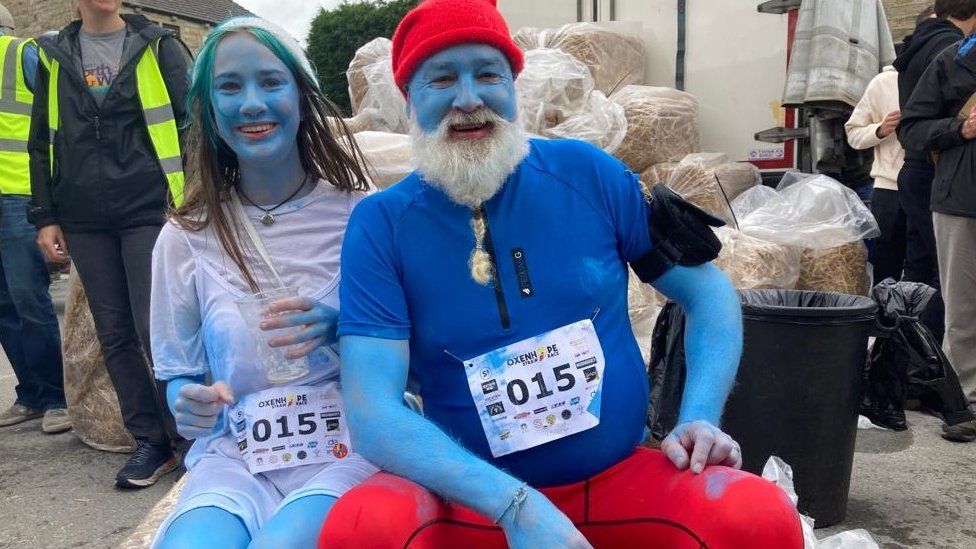 Oxenhope Straw Race: Pints and perspiration at annual bale race - BBC News