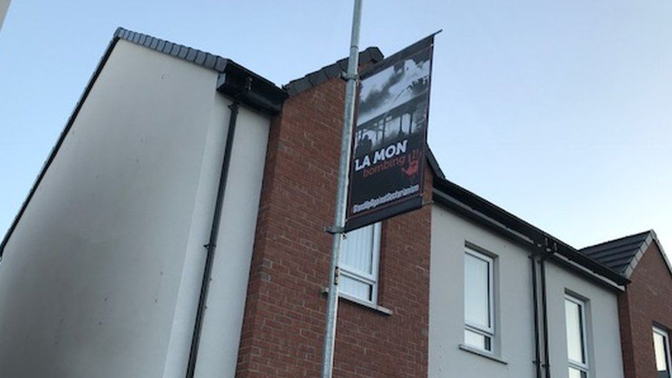 Call to remove banners from mixed Belfast housing estates - BBC News