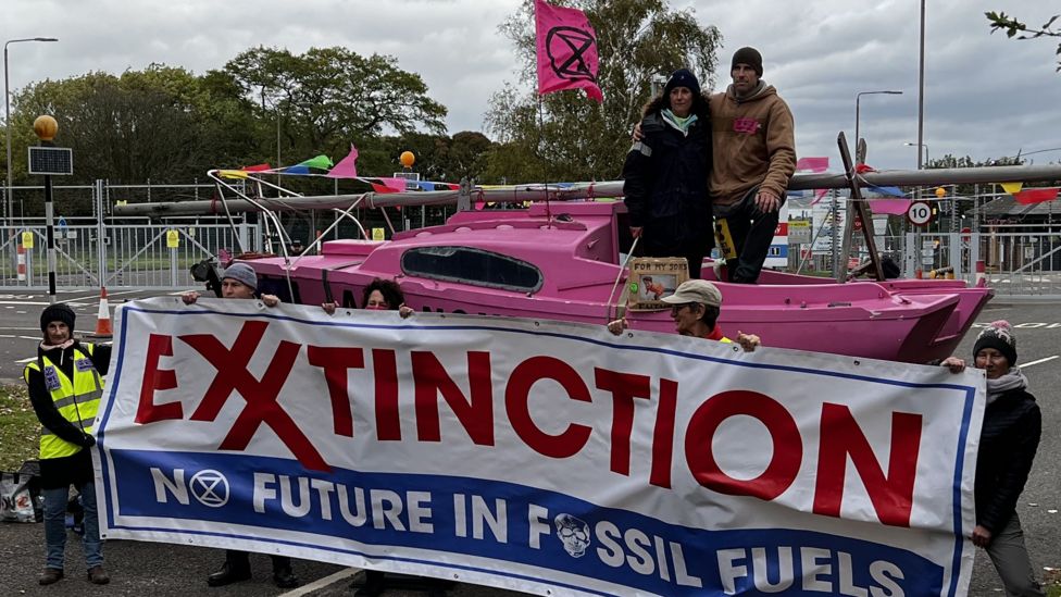 Olympians among protesters blocking Fawley oil refinery - BBC News