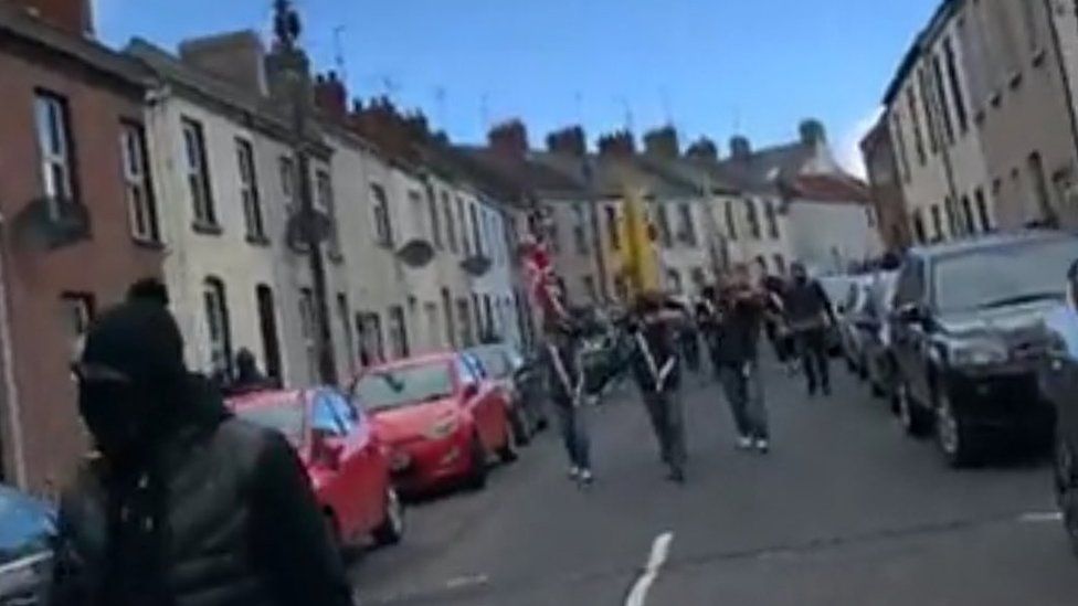 Portadown parade involving masked men investigated - BBC News