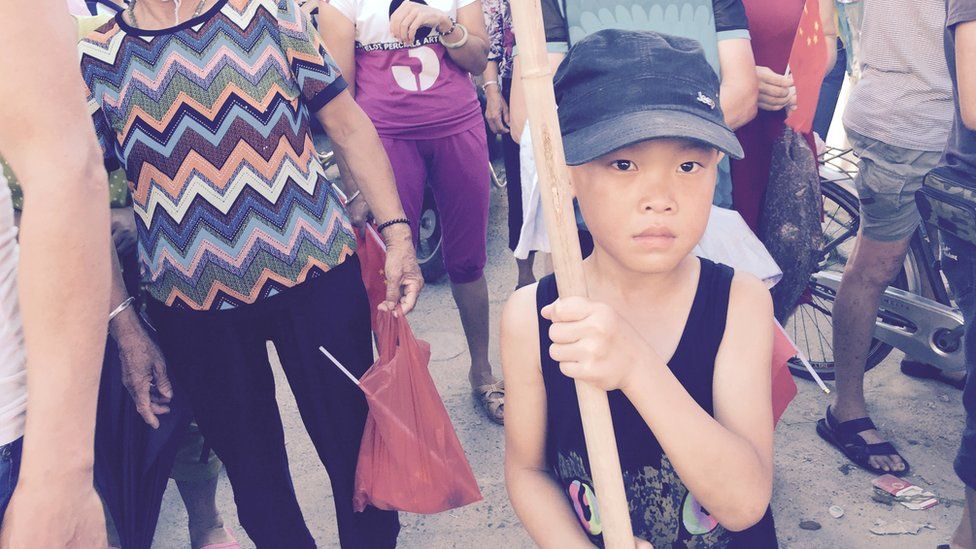 Wukan's 'rebel' villagers take to streets in ongoing protest - BBC News