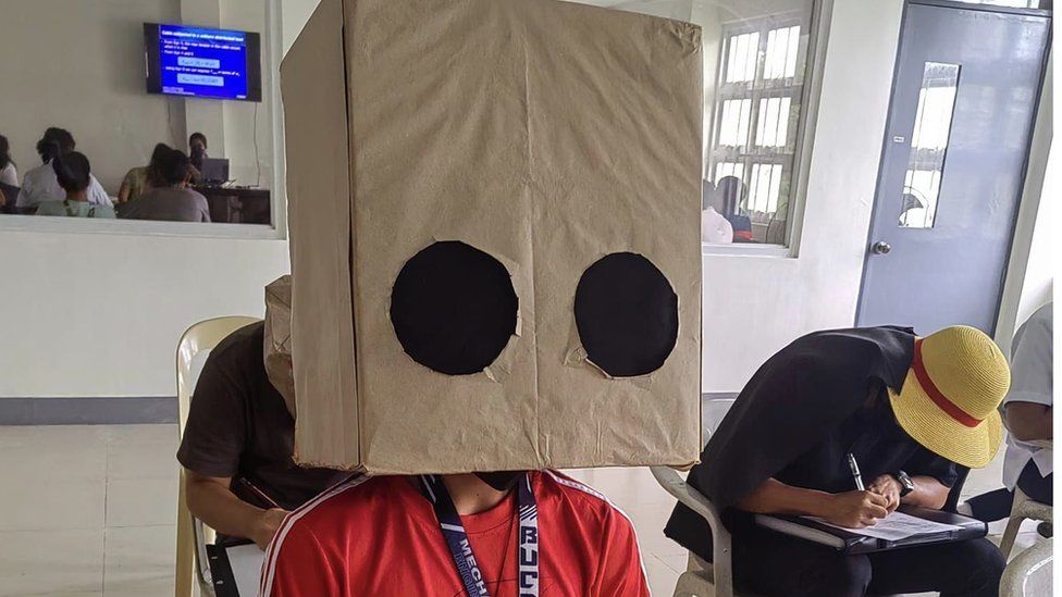 Students wear homemade 'anti-cheating' hats during exam - BBC Newsround
