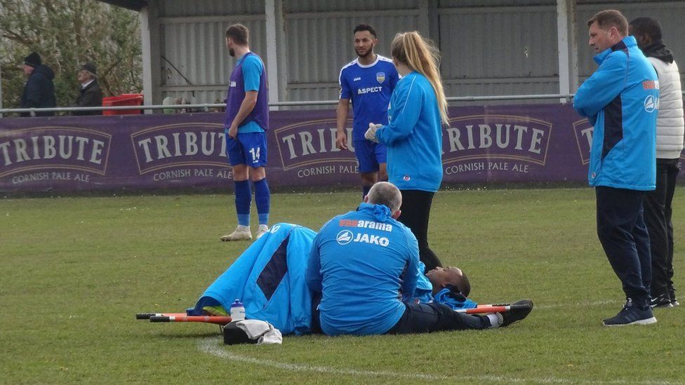 Truro City footballer lay on pitch injured for hours - BBC News