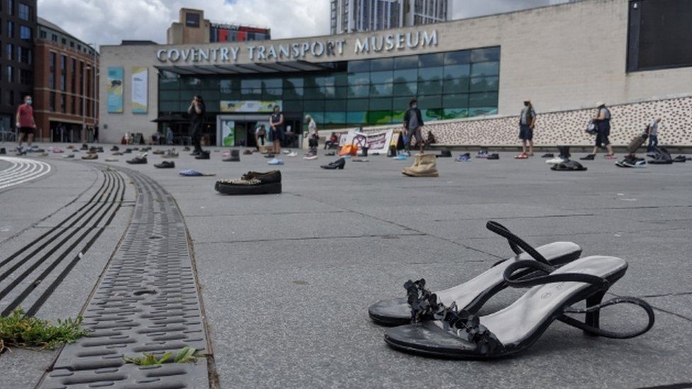 Coventry climate change protest features 168 pairs of shoes - BBC News