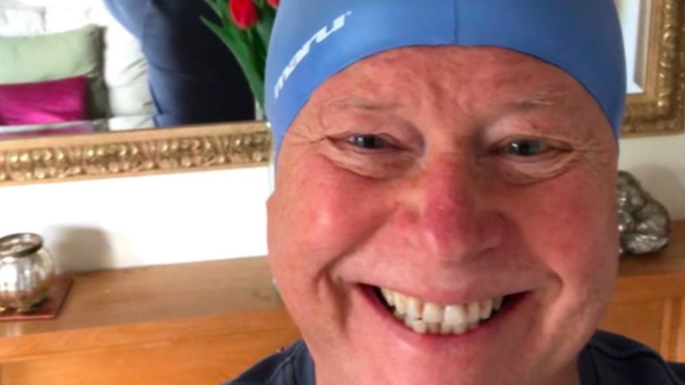 Cancer survivor completes Royal Windsor triathlon - BBC News