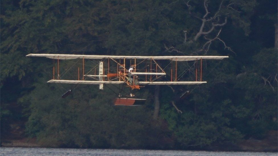Waterbird: Replica of UK's first seaplane flies over Windermere - BBC News