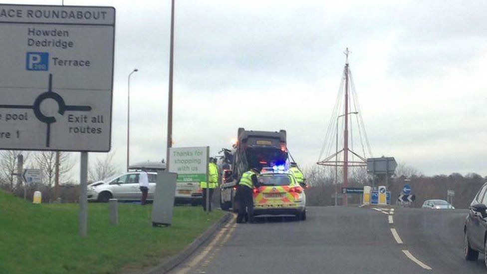 Car overturns in roundabout crash in Livingston - BBC News