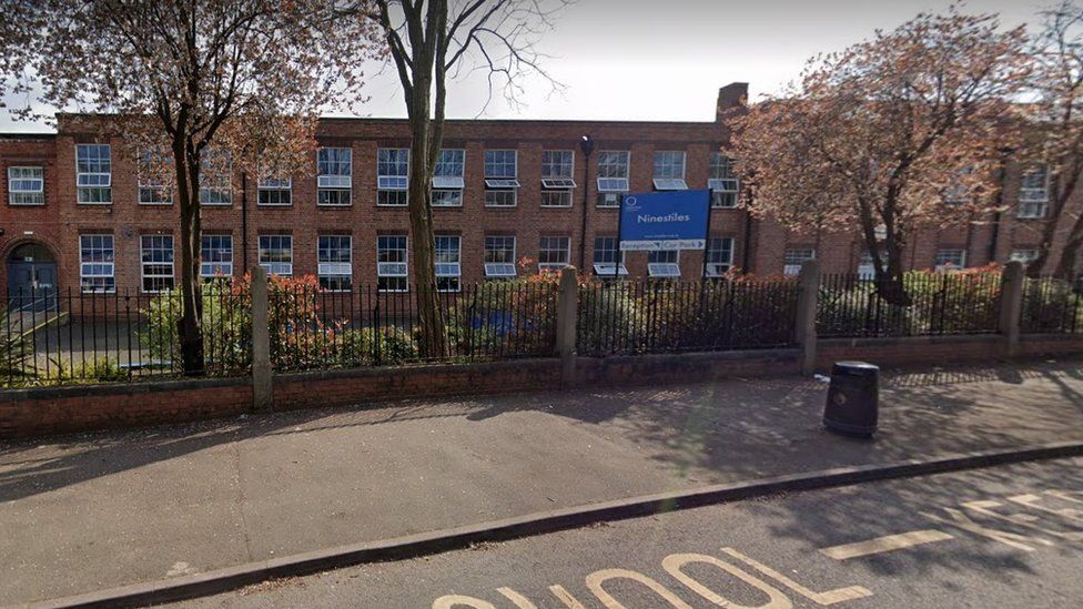 Birmingham school shuts as travellers move on to field - BBC News