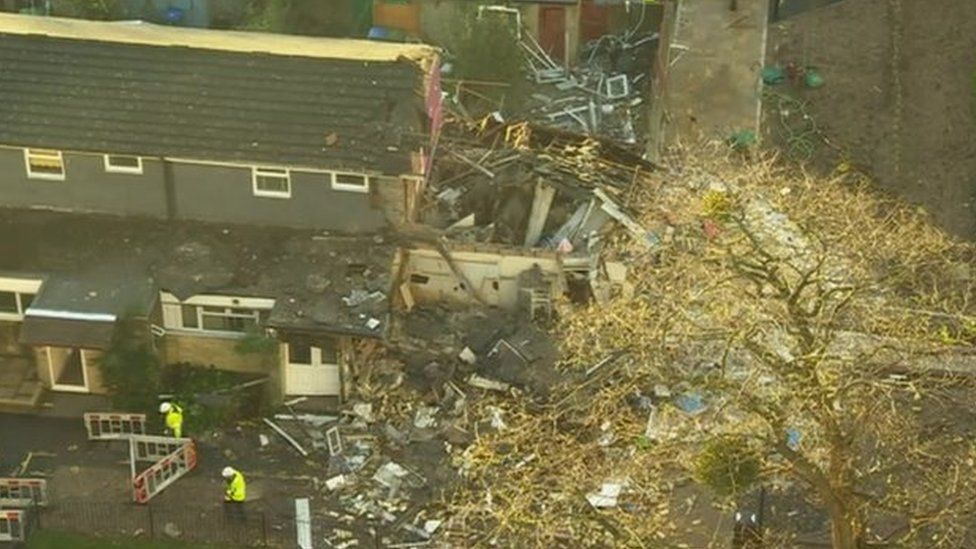 Gas explosion family return to rebuilt home - BBC News
