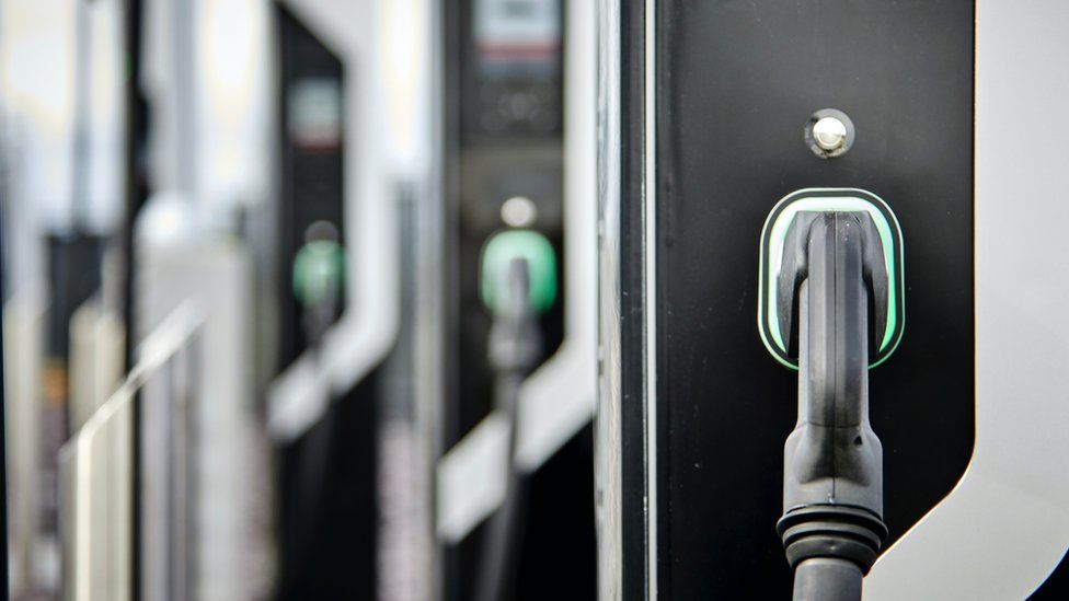 'UK's largest' EV-charging hub opens at NEC - BBC News