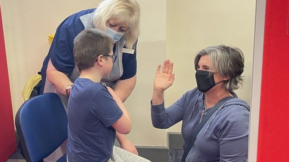 Covid: 'Getting vaccinated is best for my child' - BBC News